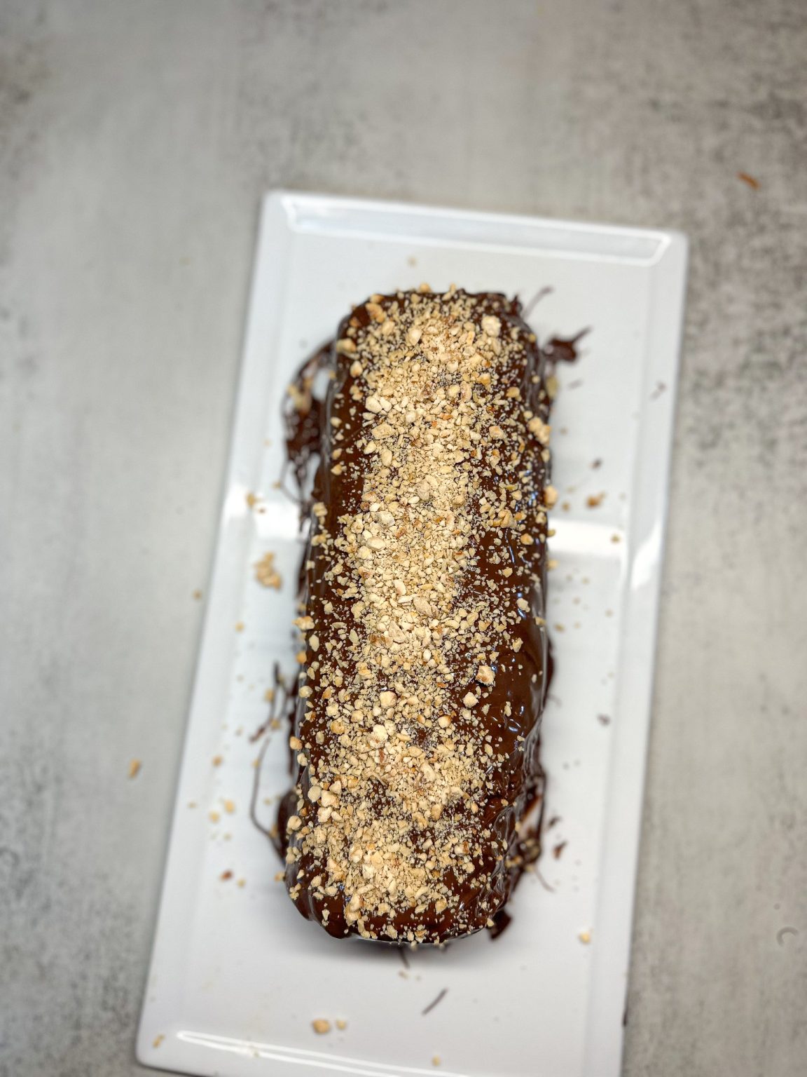 Halva (tahini) roulade glazed with chocolate and hazelnuts ...