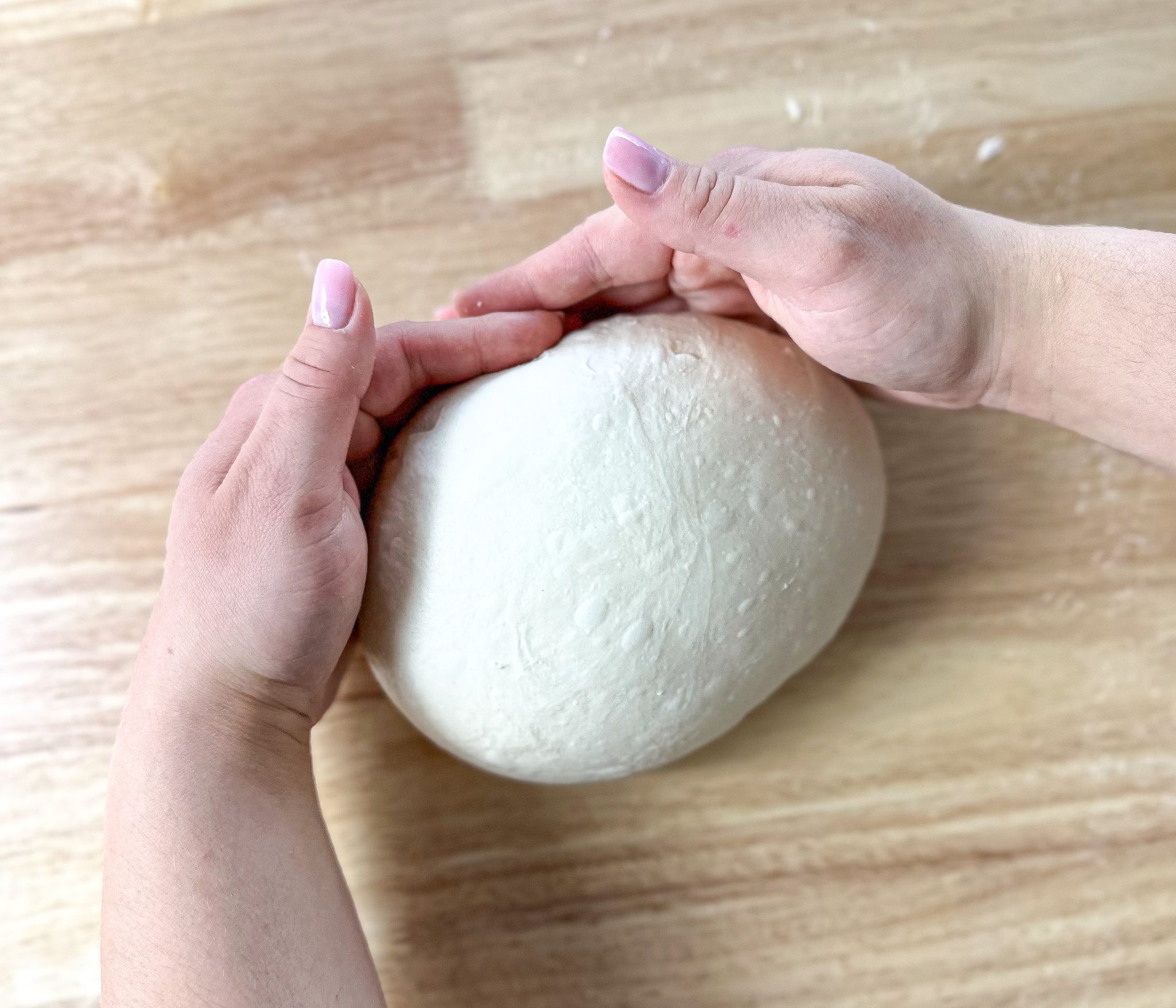 beginner guide: how to shape sourdough bread boule - lizasfarmhouse.com