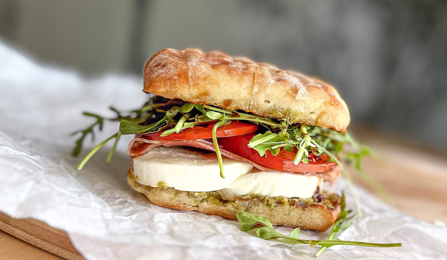 pesto caprese sandwich with a balsamic glaze - lizasfarmhouse.com