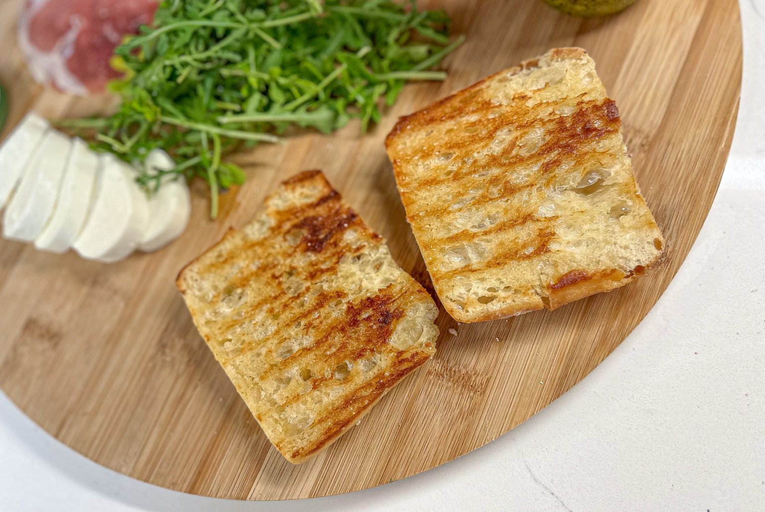pesto caprese sandwich with a balsamic glaze - lizasfarmhouse.com